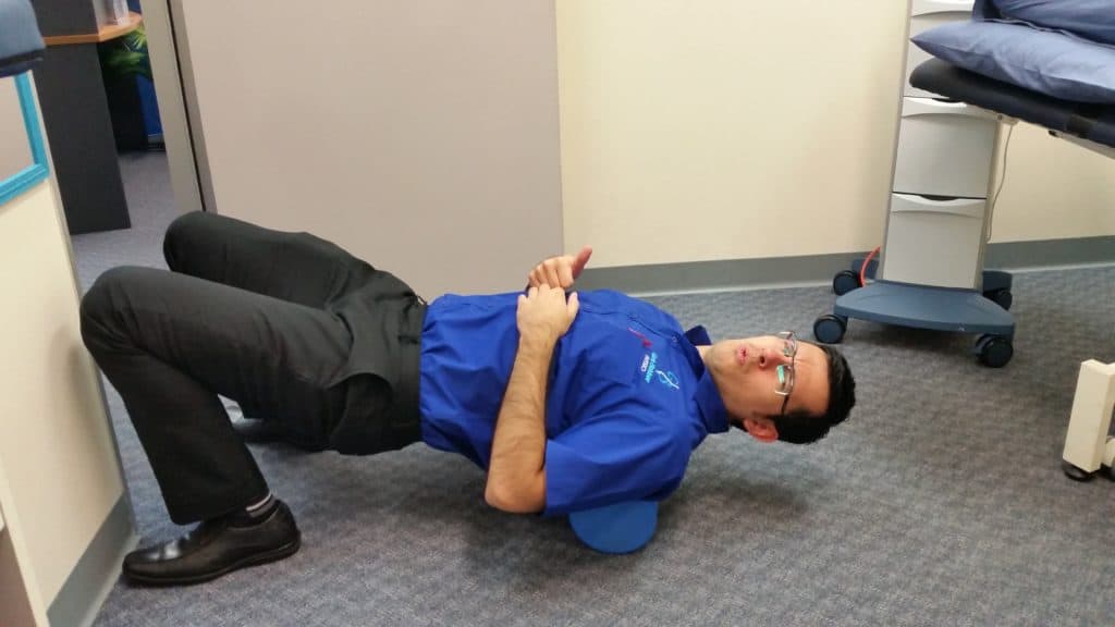 Back stretches with a foam roller · Get Better Physio
